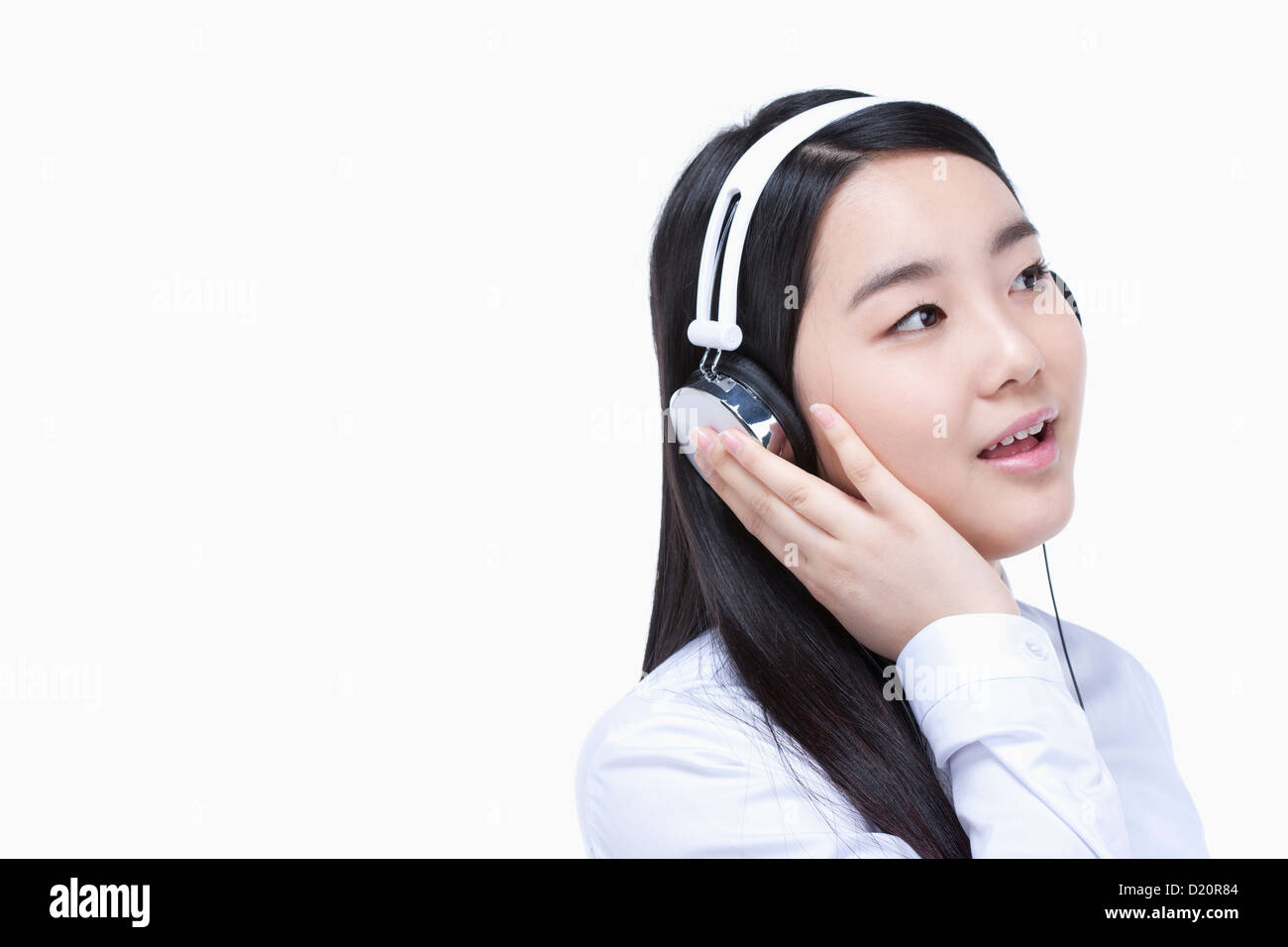 a female student listening on a headphone Stock Photo - Alamy