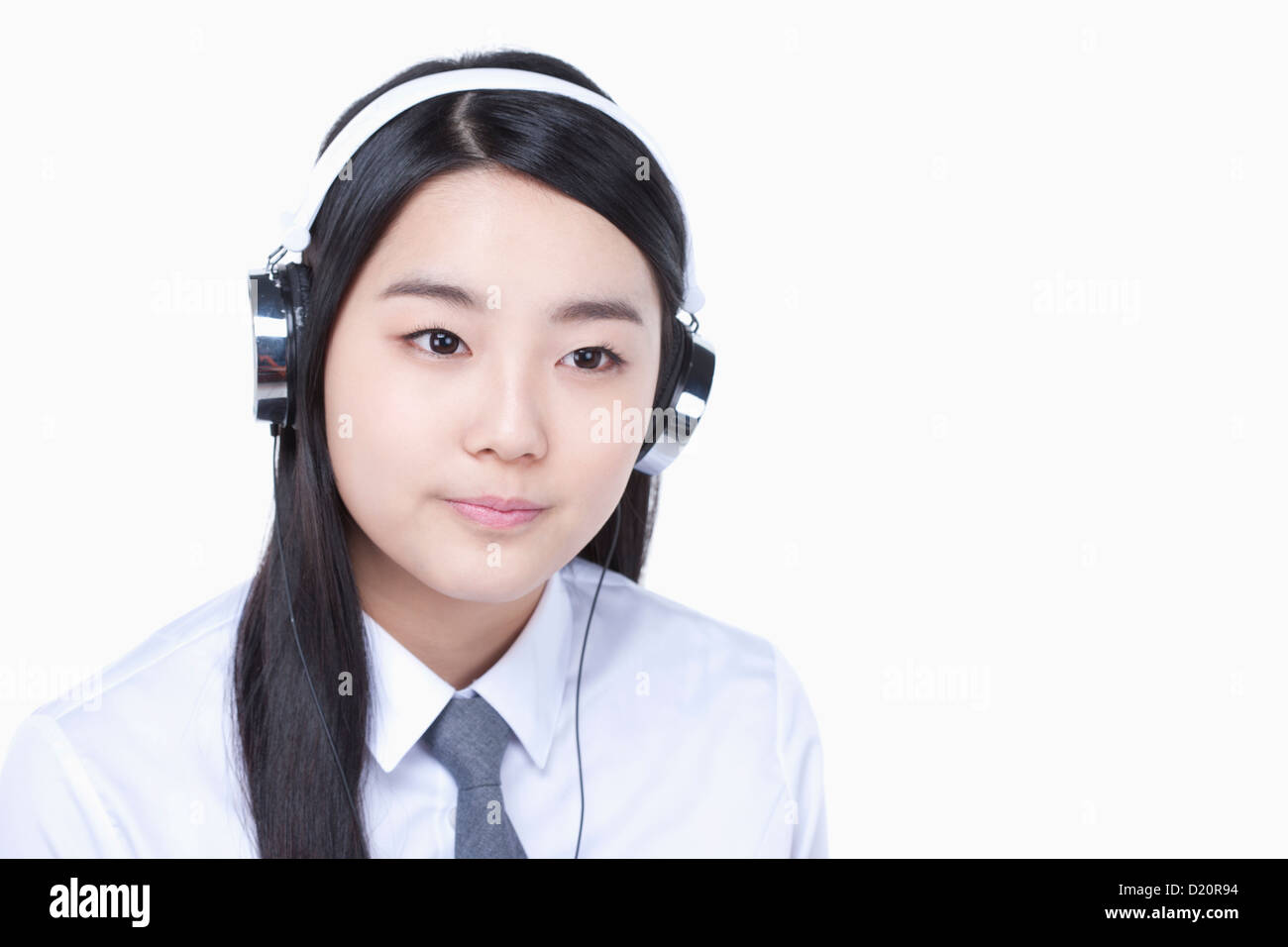 a female student listening on a headphone Stock Photo - Alamy