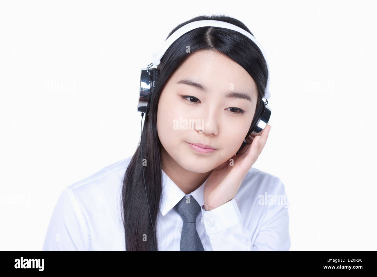 Female student listening music hi-res stock photography and images - Alamy