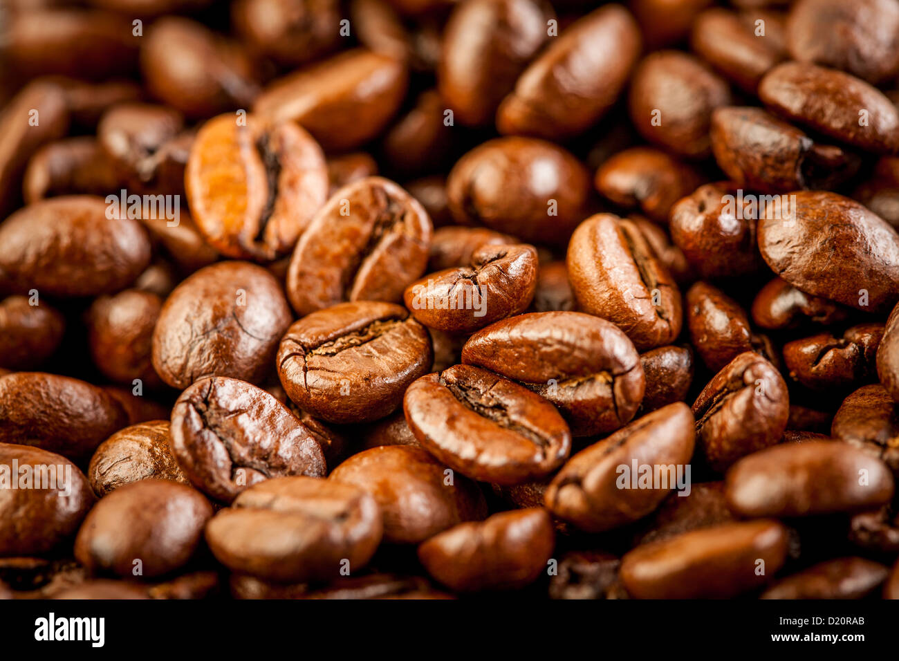 Fragrant fried coffee beans background Stock Photo - Alamy