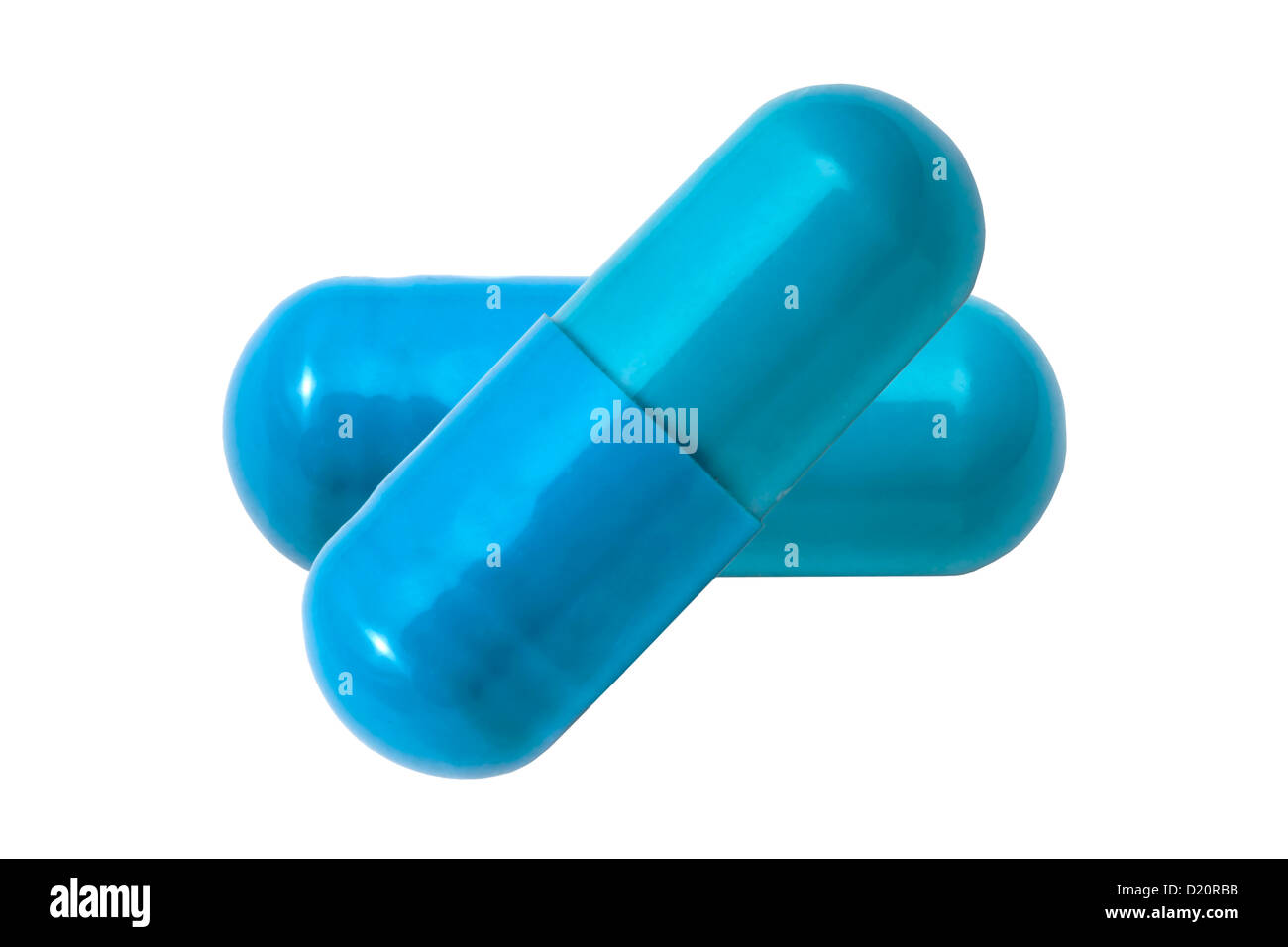 Blue capsules isolated on white background Stock Photo - Alamy