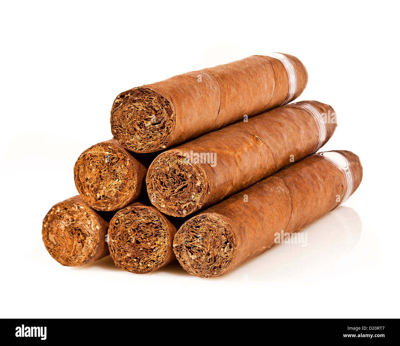 Six cigars on a white background Stock Photo - Alamy