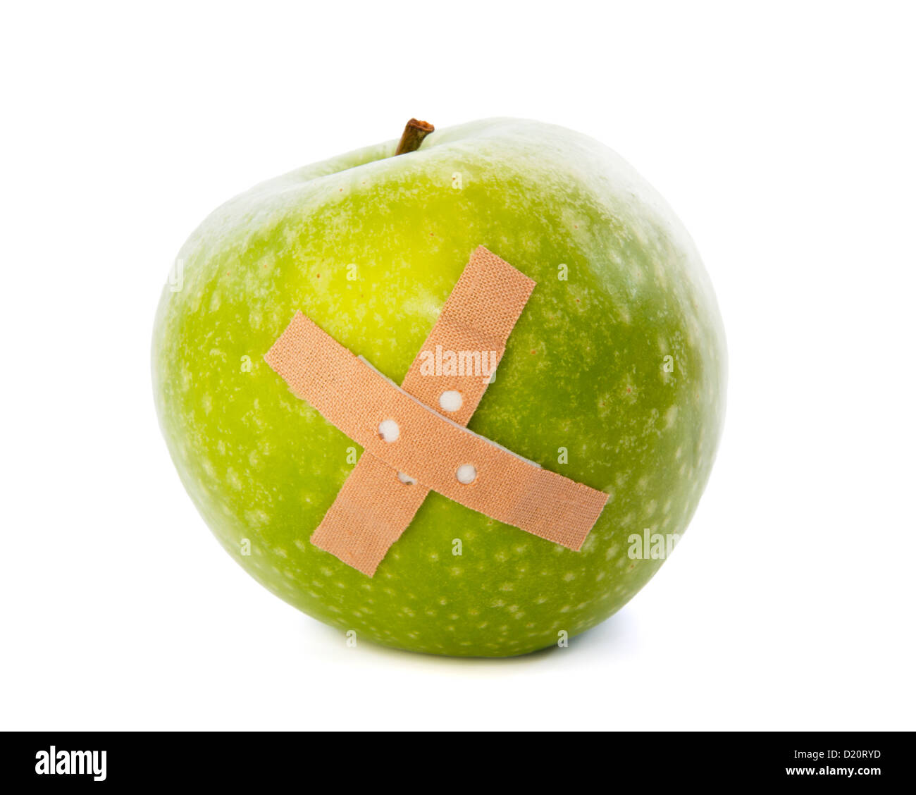 Apple with plaster against white background Stock Photo - Alamy