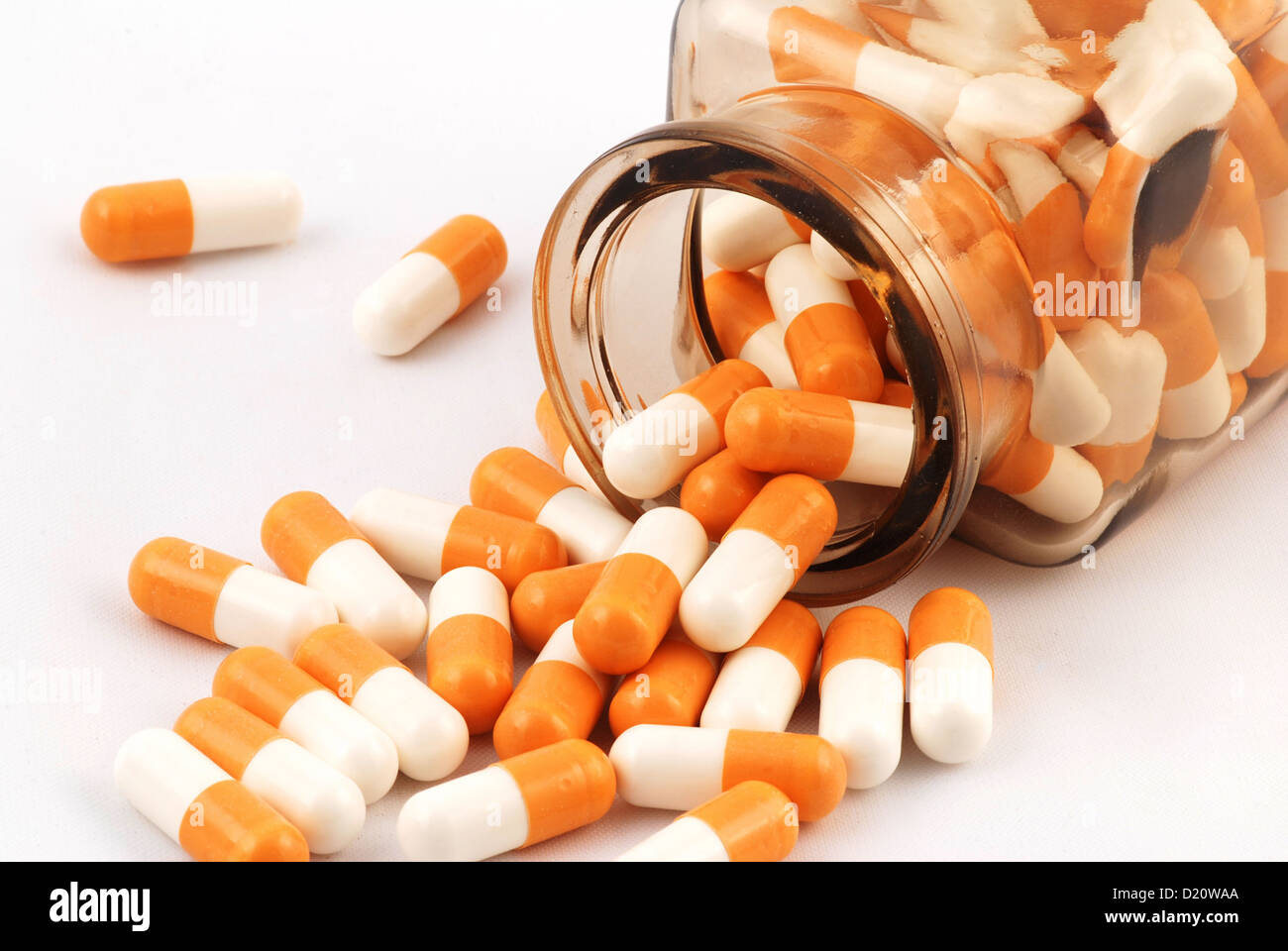Glass jar with medical pills inside and outside Stock Photo - Alamy