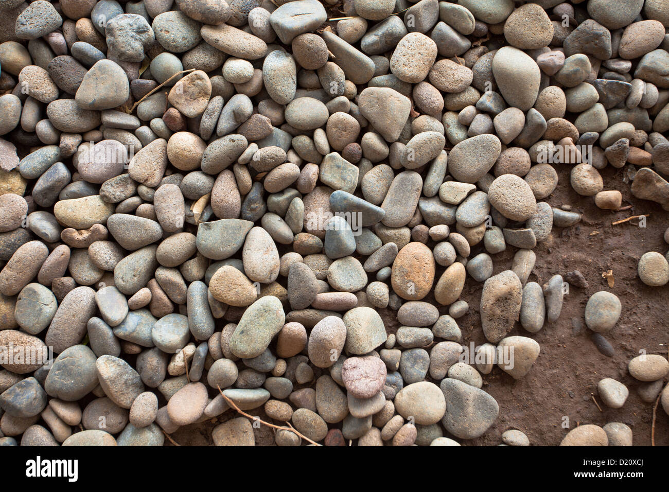 Pebble display with earth showing in bottom right corner Stock Photo ...