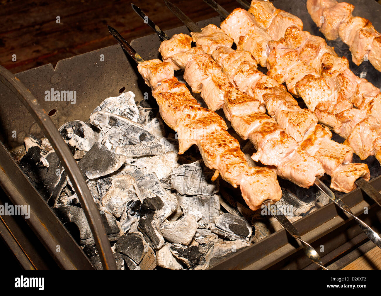 sizzling barbecue sticks with meat Stock Photo - Alamy