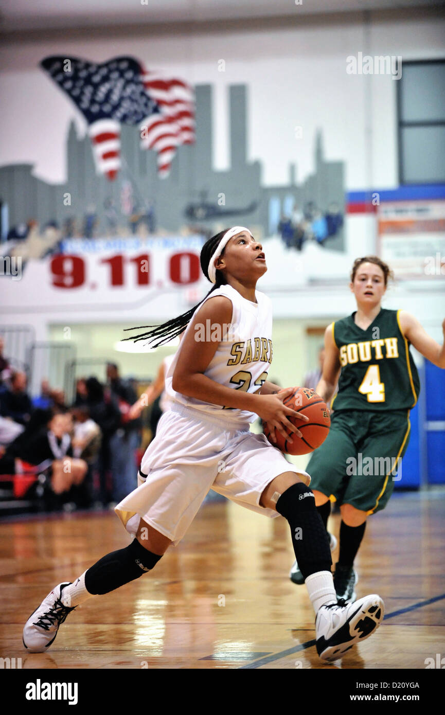 Sport Basketball female player completing a baseline drive with the ...