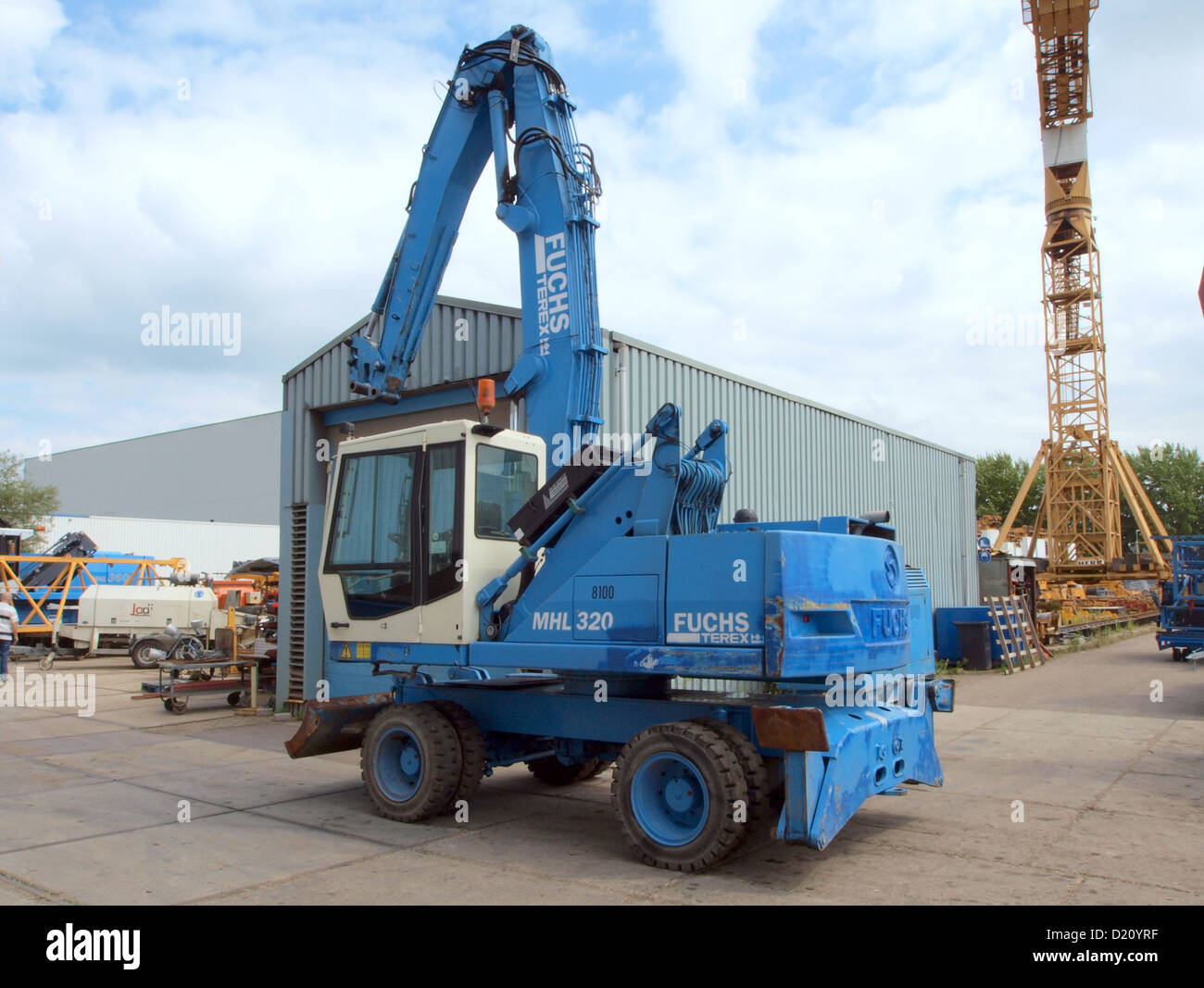 The Terex Fuchs MHL 320 is a wheeled material handler designed for ...