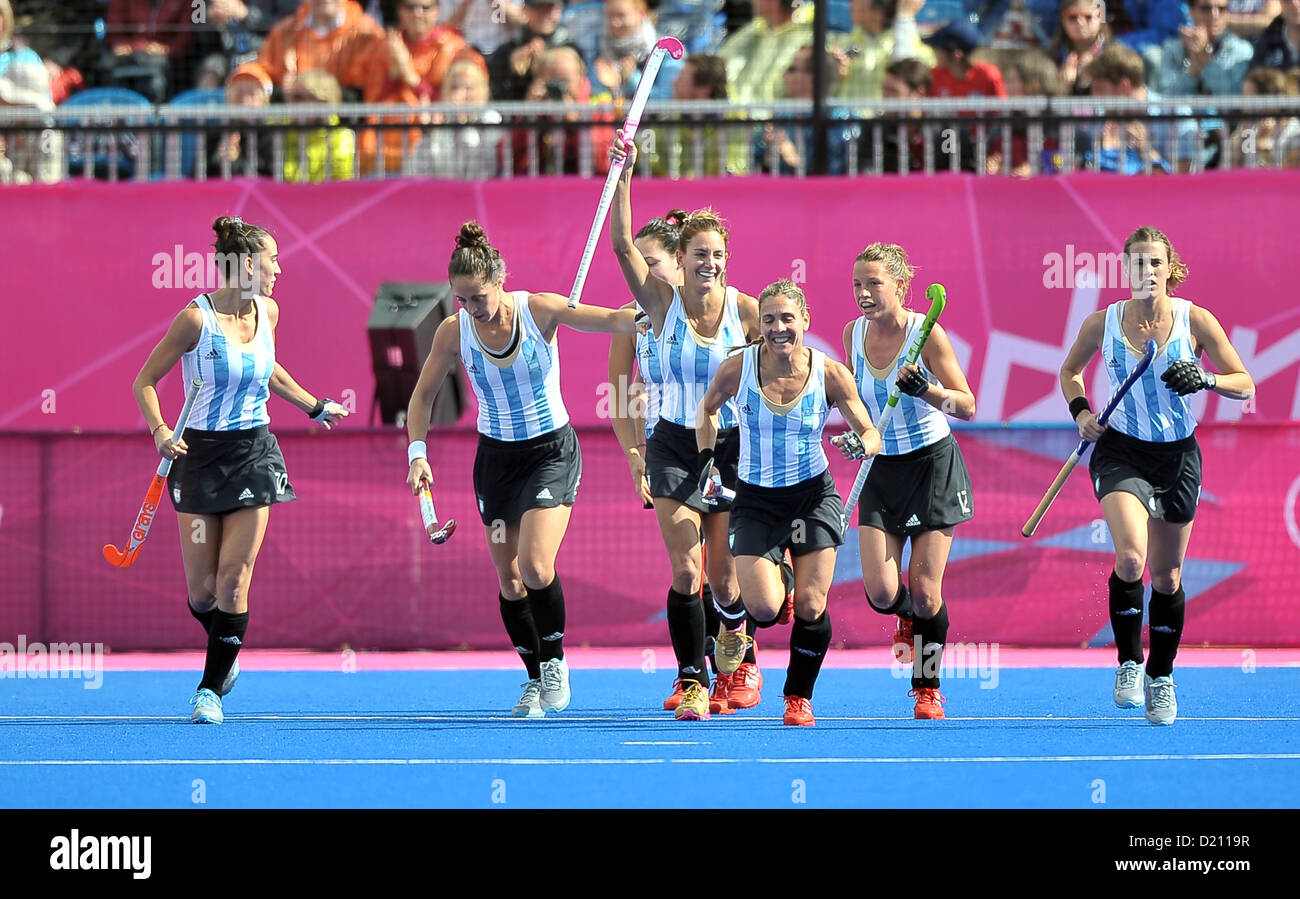 The Argentine players celebrate with goalscorer Luciana Aymar ...