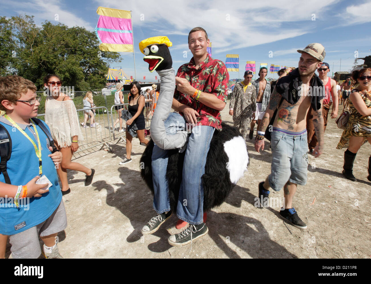 festivalgoer sitting on a bird costume, BESTIVAL FESTIVAL, ISLE OF ...