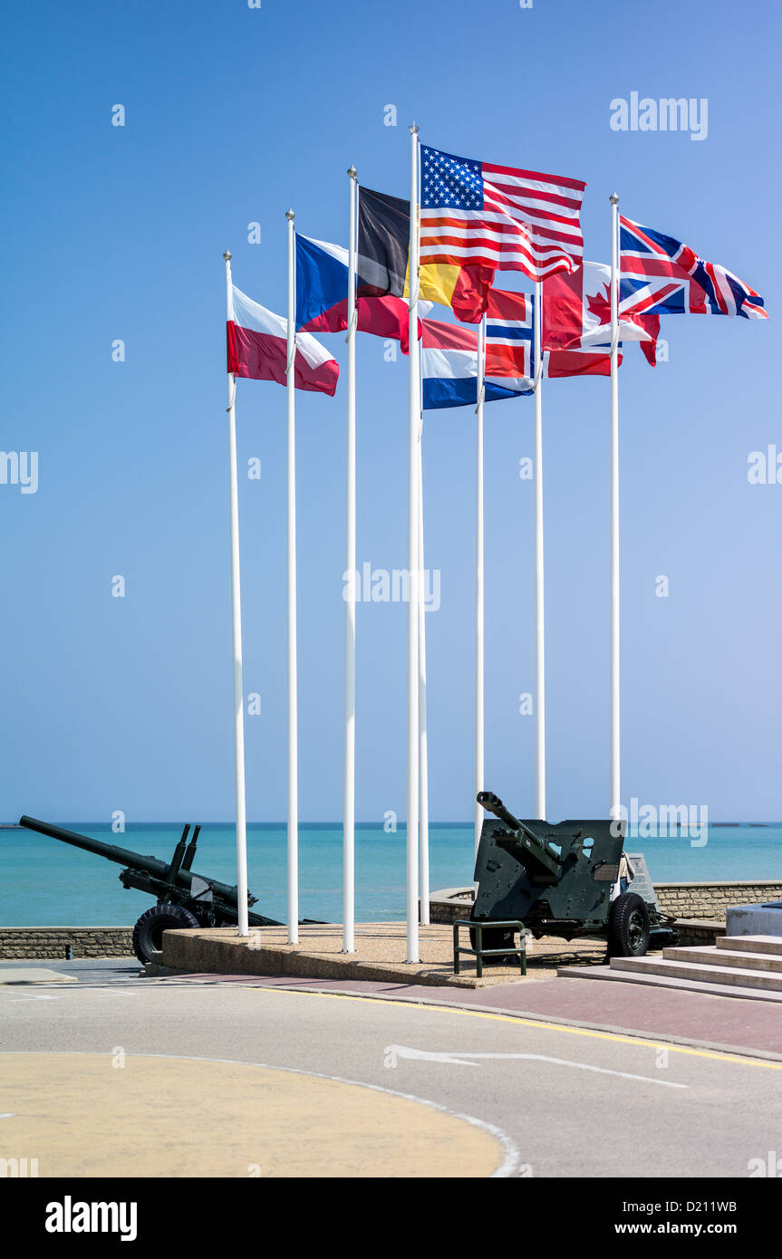 France, Normandy, Arromanches, flags and weapon in the places of the ...