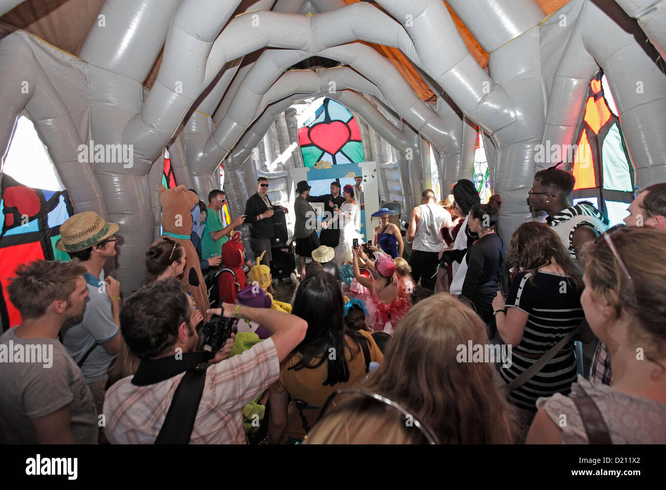 a wedding inside the inflatable wedding chapel at BESTIVAL FESTIVAL ...