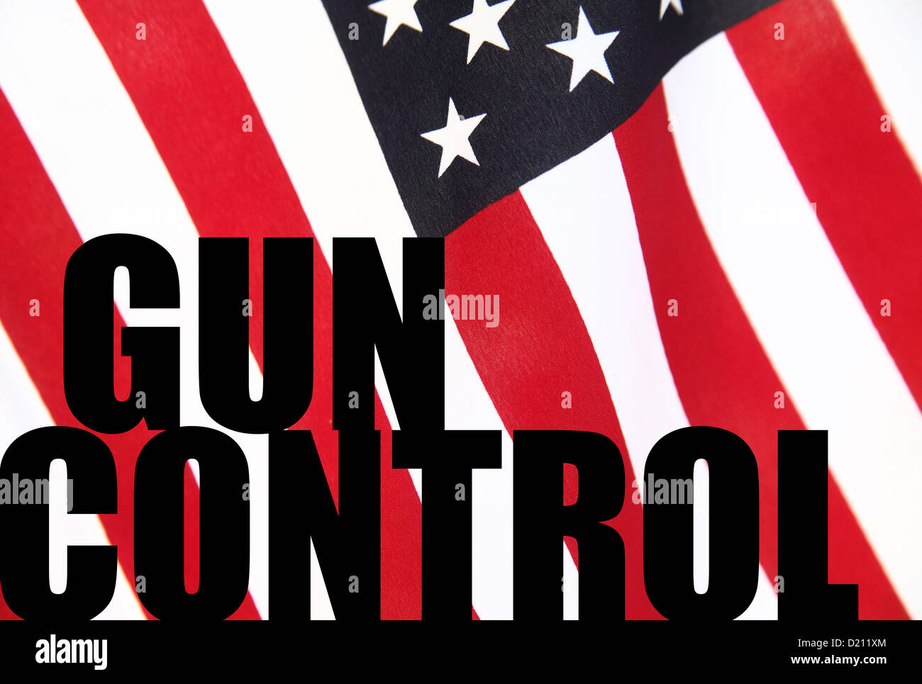 the words gun control on a USA flag background Stock Photo - Alamy