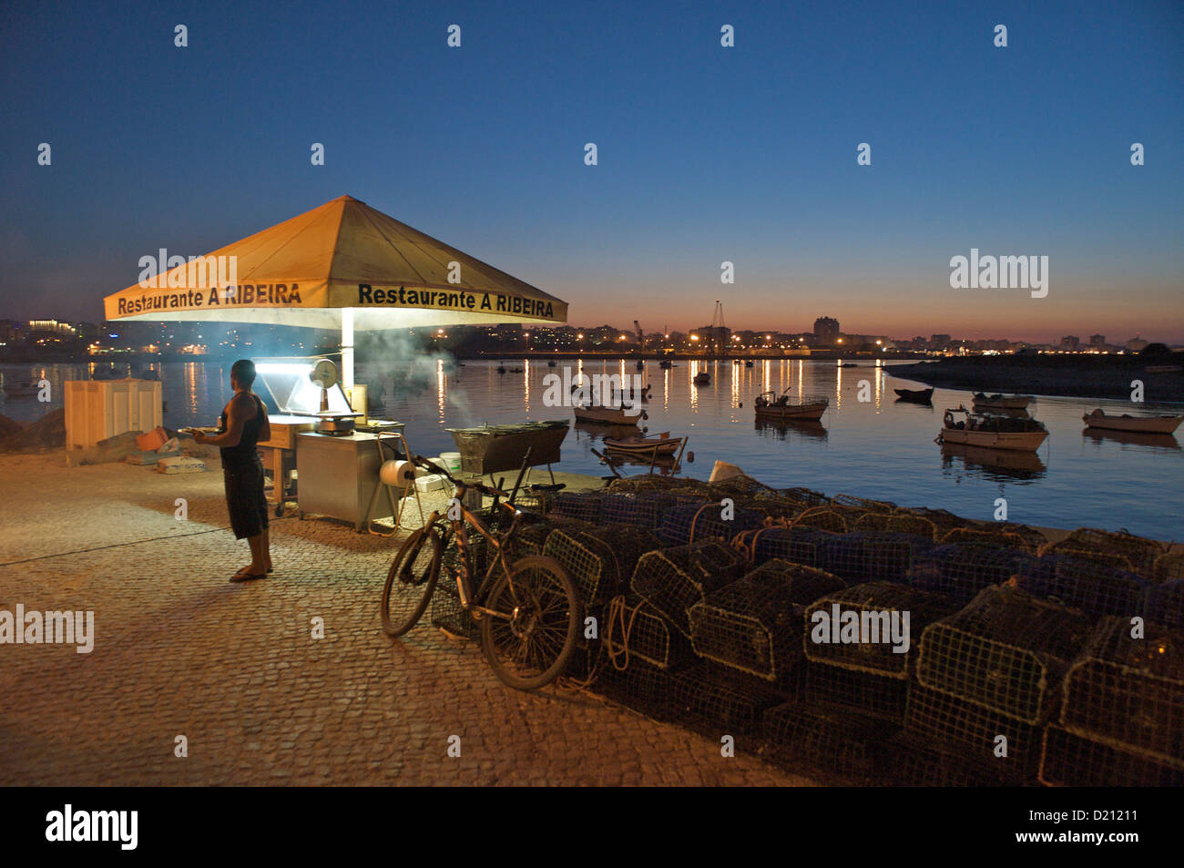 Grill at Arade river at Ferragudo and view across the river towards ...