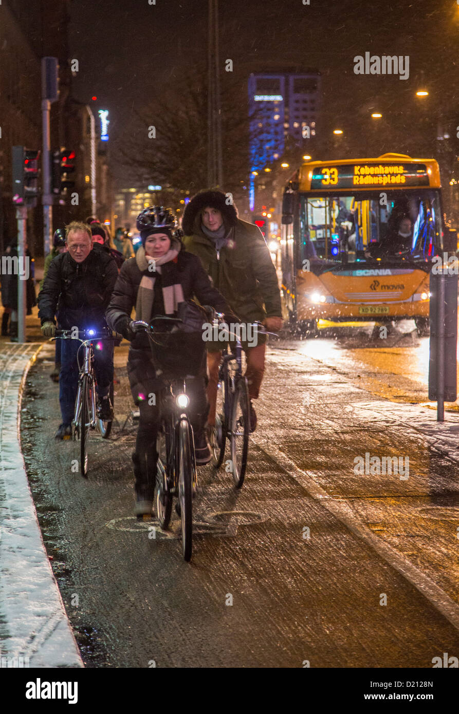 Bike, cycle traffic in the city, at night, snowfall, bike path ...