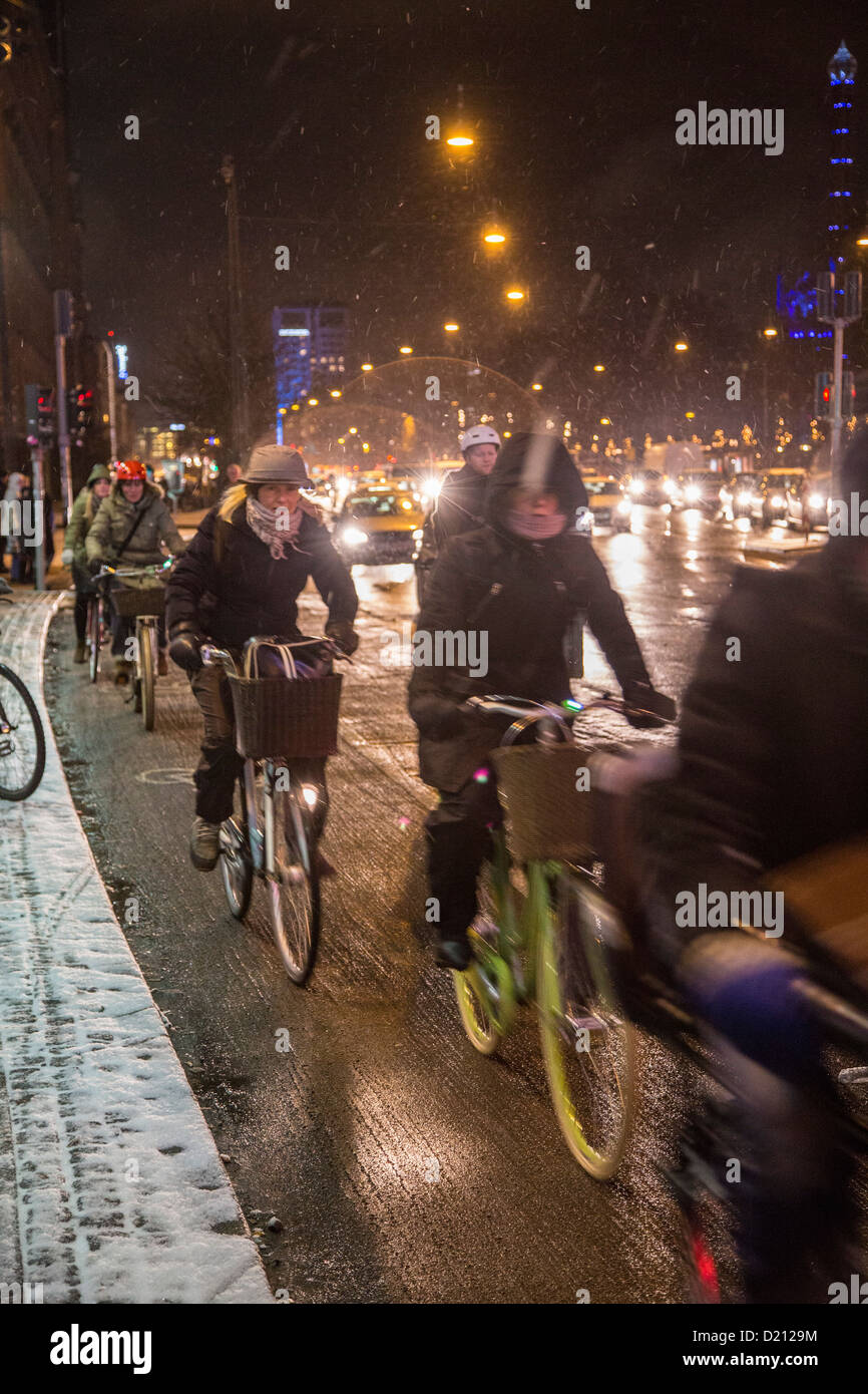 Bike, cycle traffic in the city, at night, snowfall, bike path ...