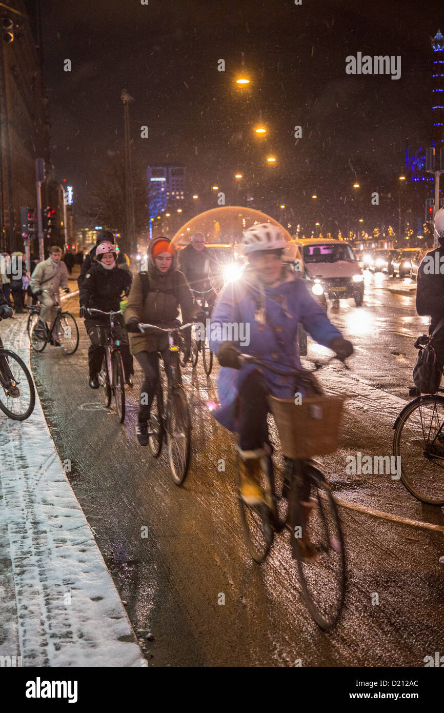 Bike, cycle traffic in the city, at night, snowfall, bike path ...