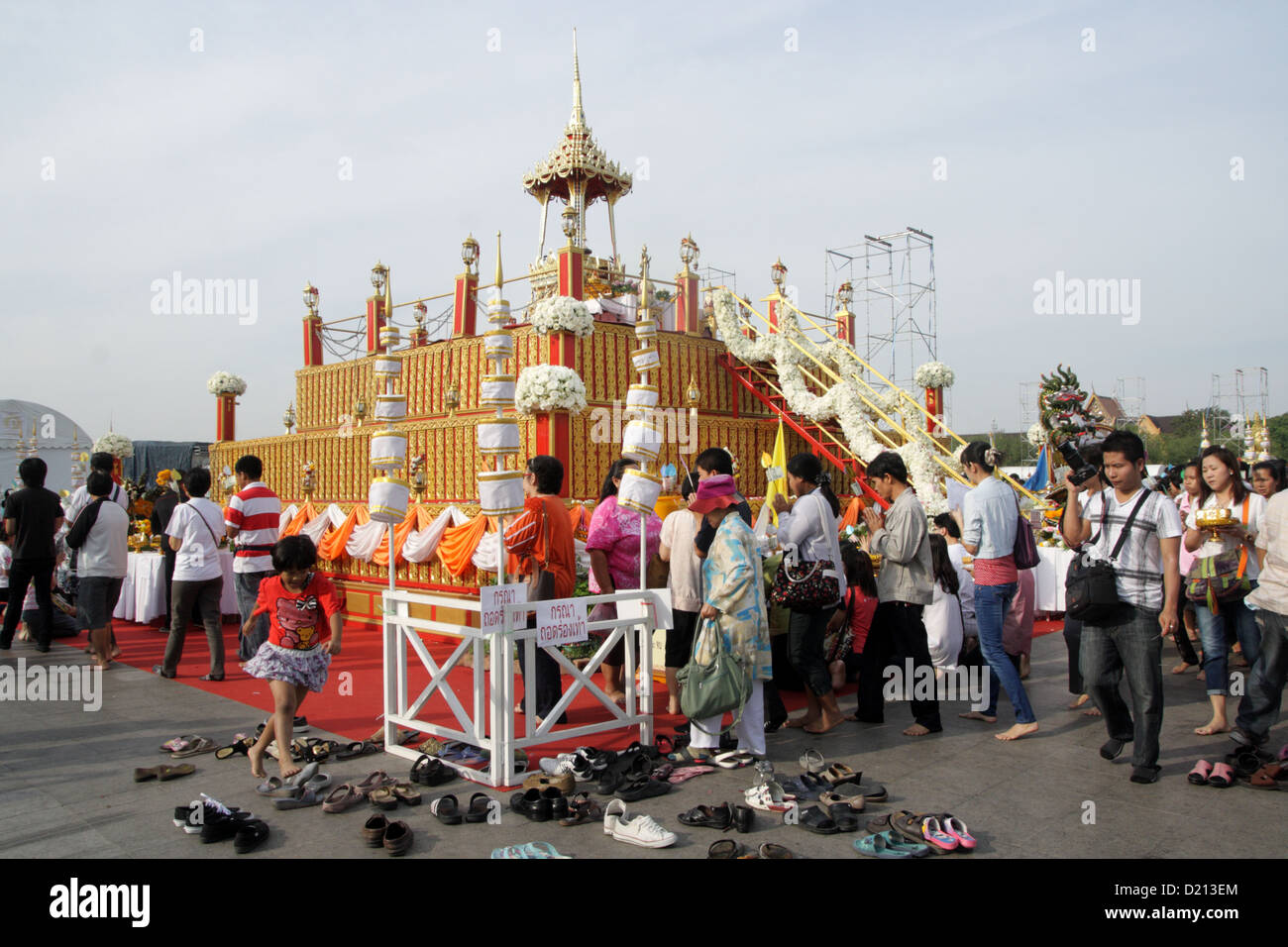 People prays at a shrine during a special merit making ceremony at ...