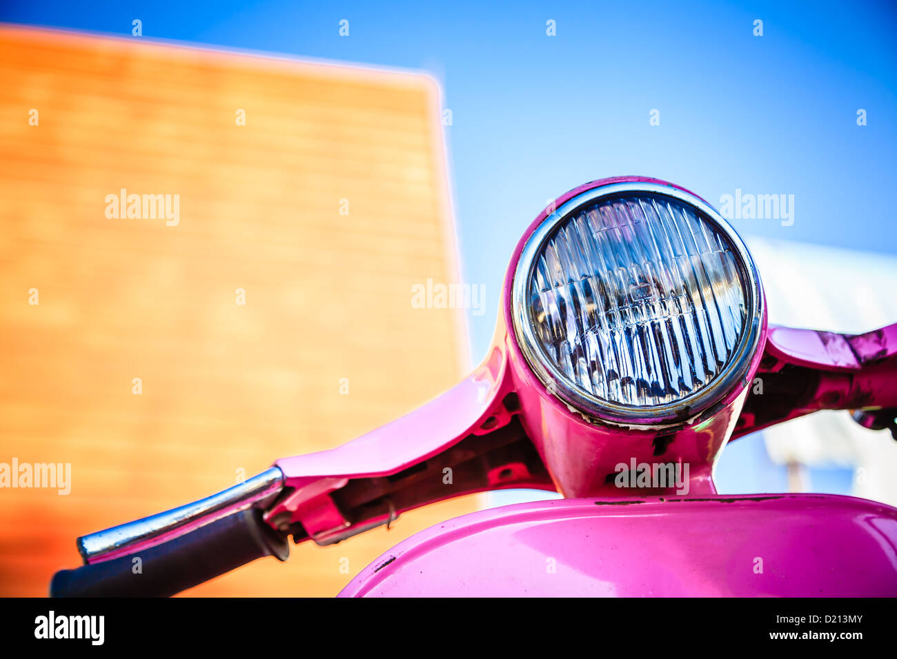 Close-up pink retro motorcycle with colorful background Stock Photo - Alamy