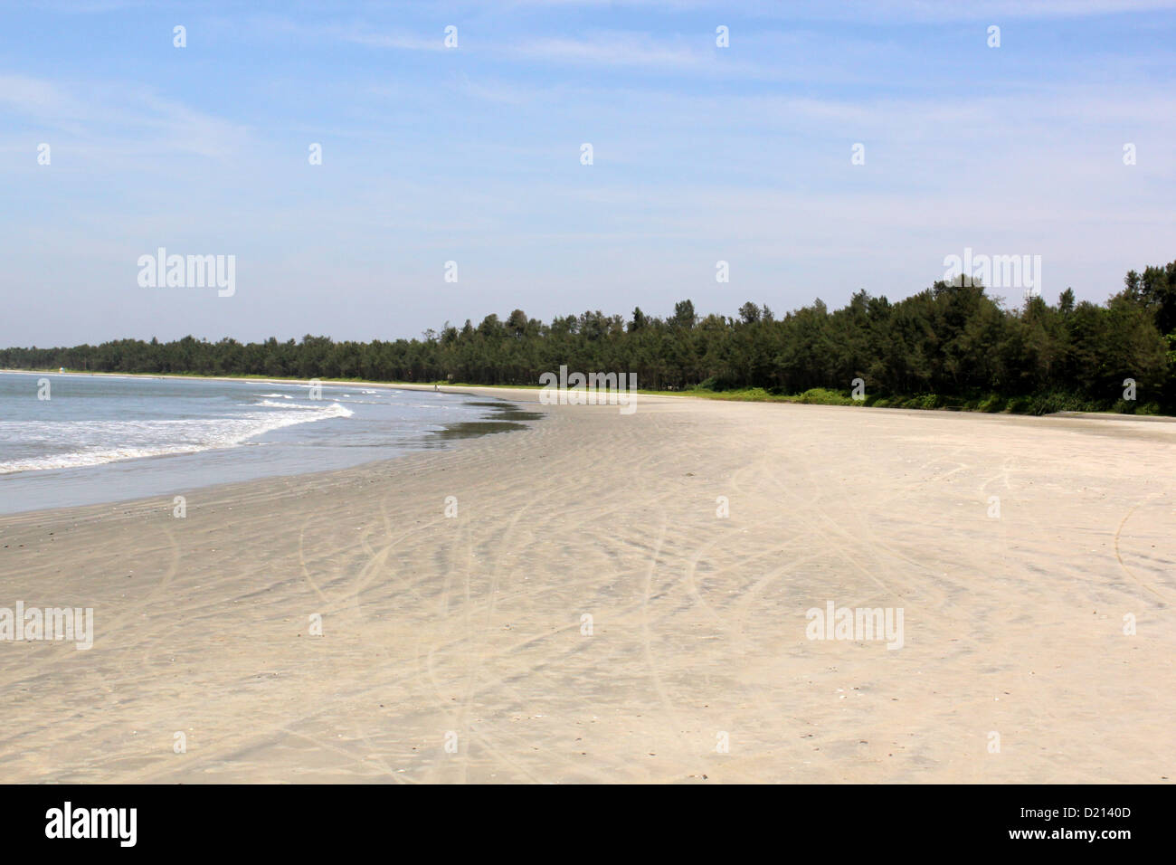 Beach with yellow sand and bright blue sky Kannur Kerala India Stock ...
