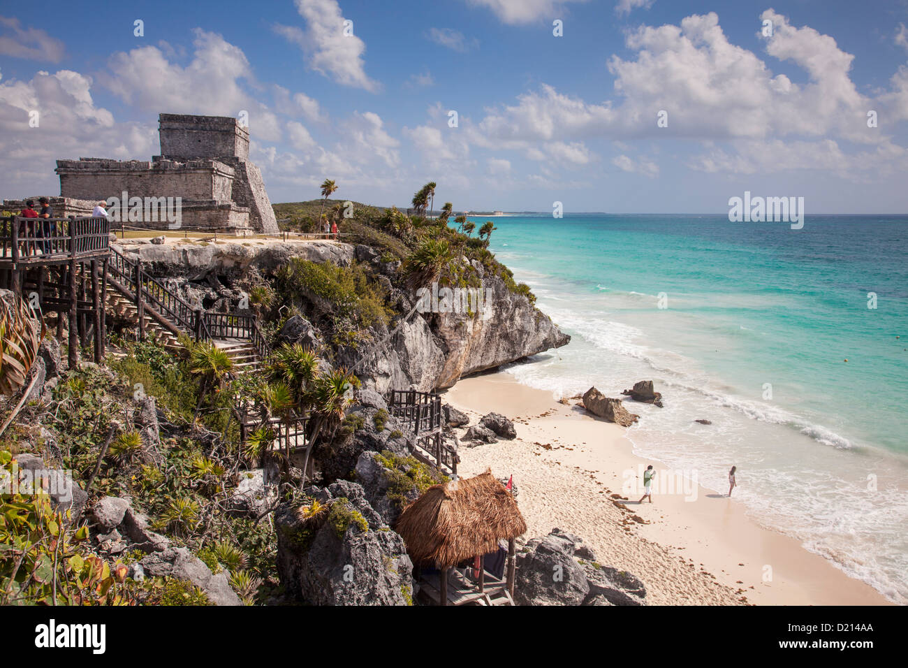 Ancient Mayan buildings at Tulum Ruins and people on the beach, Tulum ...