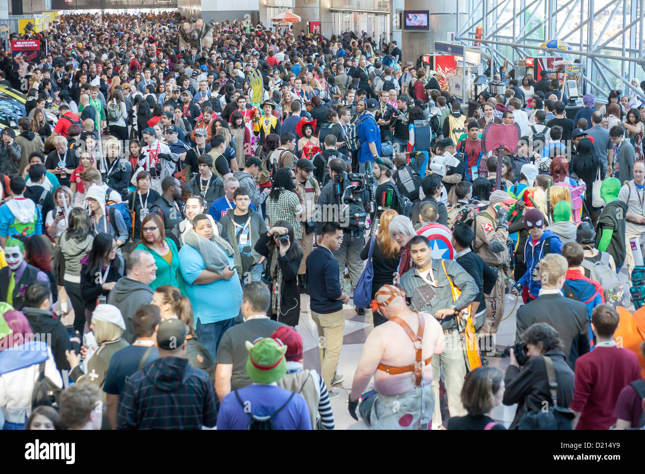 A crowd of visitors and fans to the ComicCon comic book and movie ...