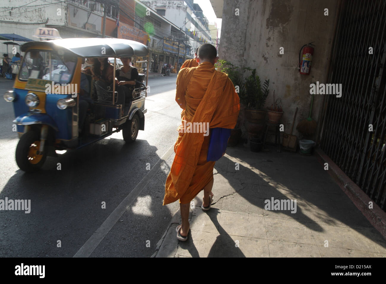 Thai Buddhist monk walking on the street in Bangkok , Thailand Stock ...