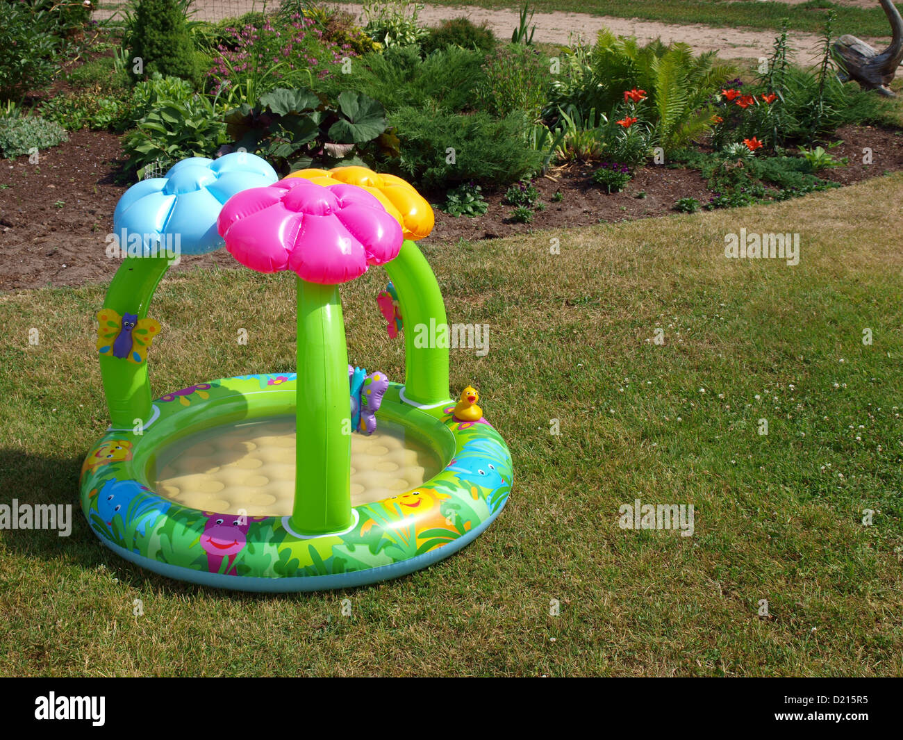 Small colorful plastic inflatable baby swimming pool Stock Photo - Alamy