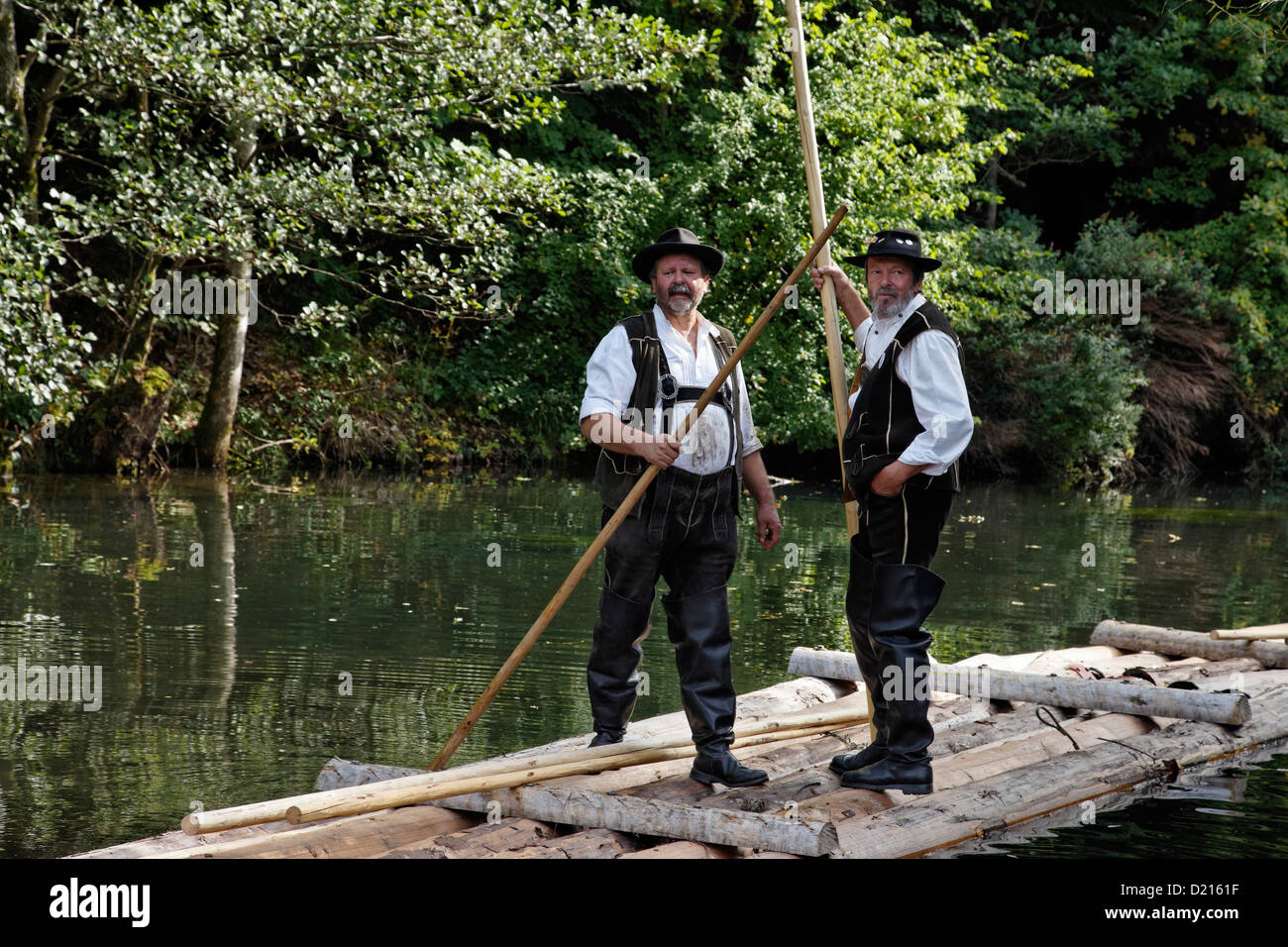 Men in traditional costumes on a raft, Timber rafting festival ...
