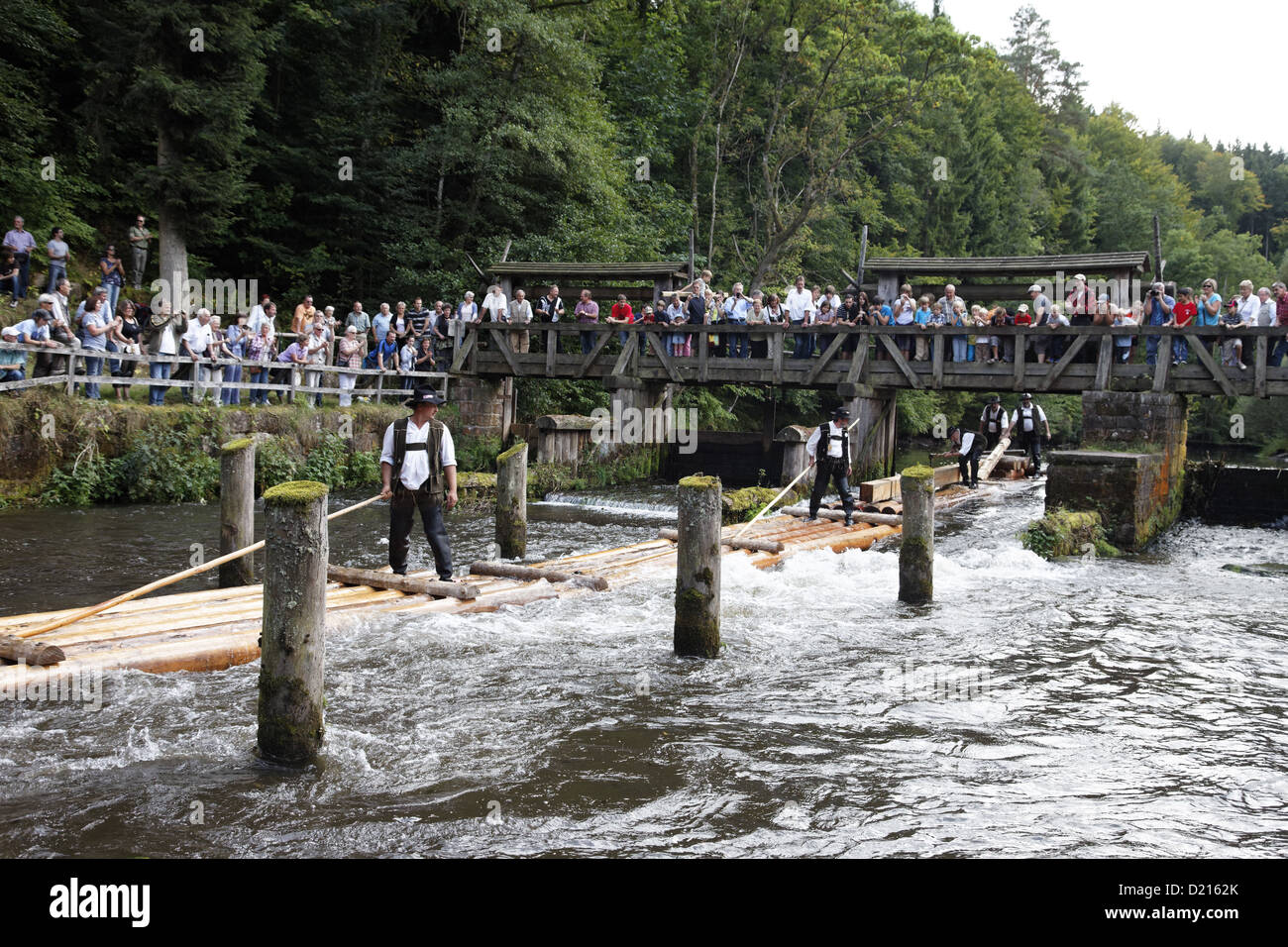 Men in traditional costumes on a raft, Timber rafting festival ...