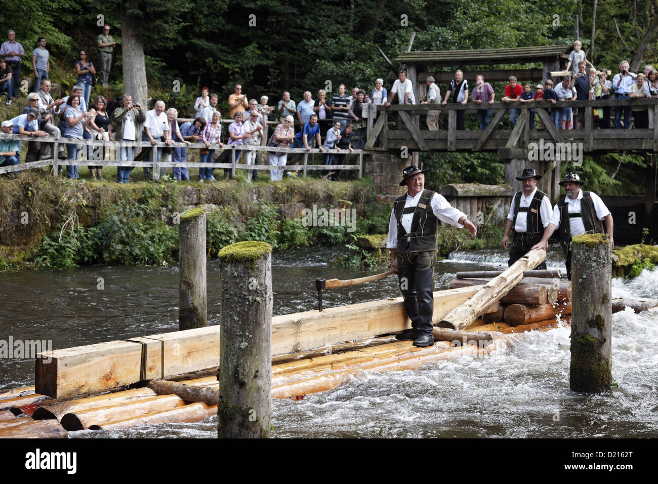 Men in traditional costumes on a raft, Timber rafting festival ...