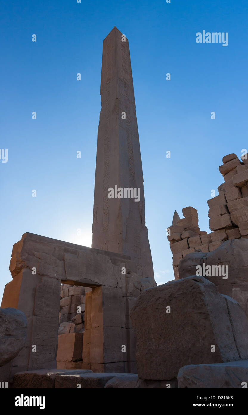 An ancient Egyptian obelisk late in the afternoon inside the Karnak ...