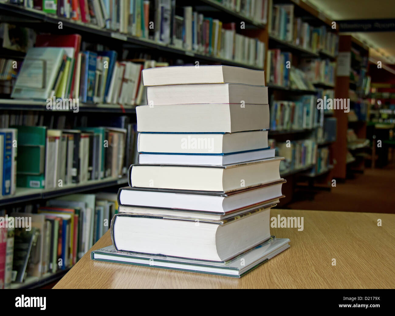 Pile of books in library, ready for use Stock Photo - Alamy