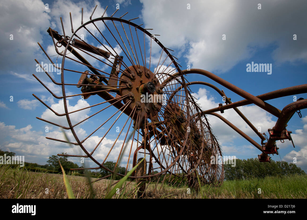 Abandoned Farm machinery is left to rust in overgrown fields near ...
