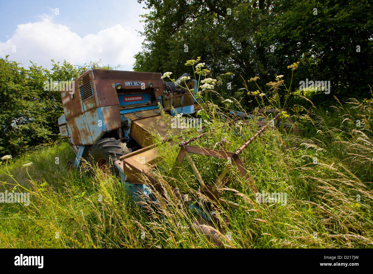 Abandoned Farm machinery is left to rust in overgrown fields near ...