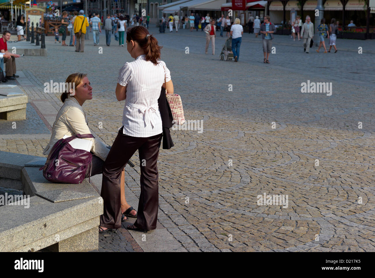 Two women meet on street hi-res stock photography and images - Alamy