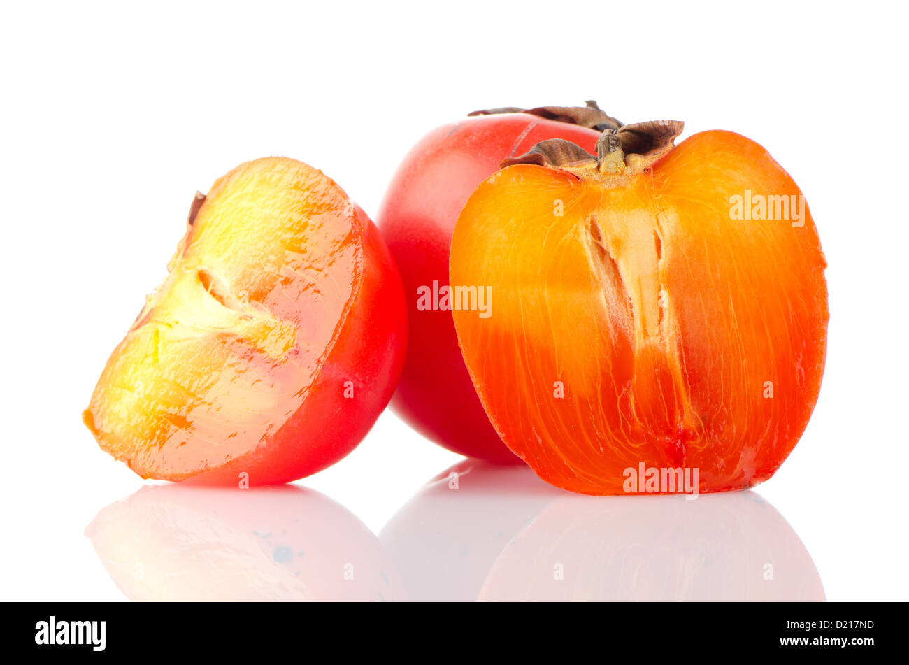 Ripe persimmons on white background Stock Photo - Alamy
