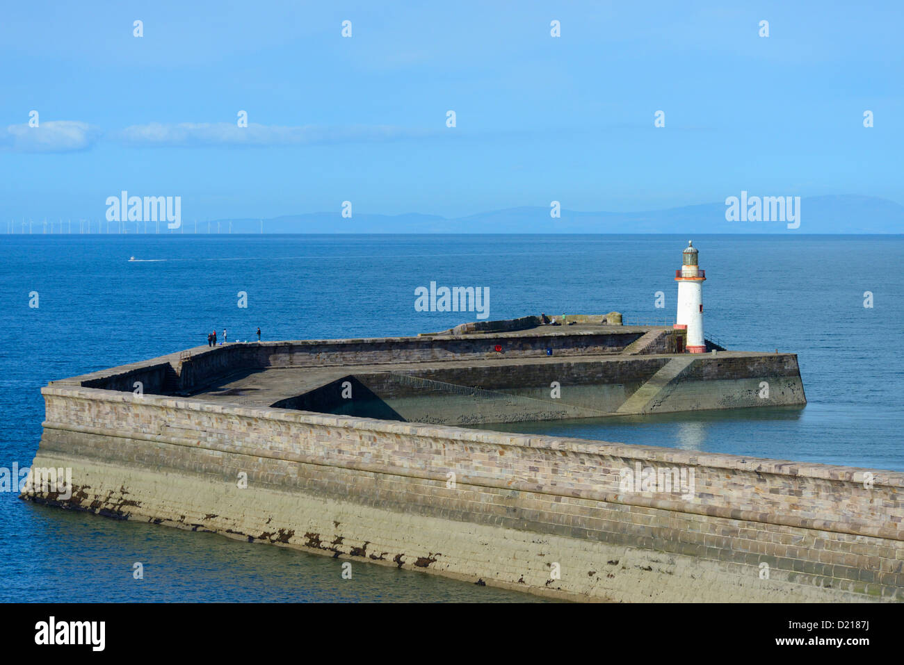 Harbour wall and lighthouser. The Harbour, Whitehaven, Cumbria, England ...