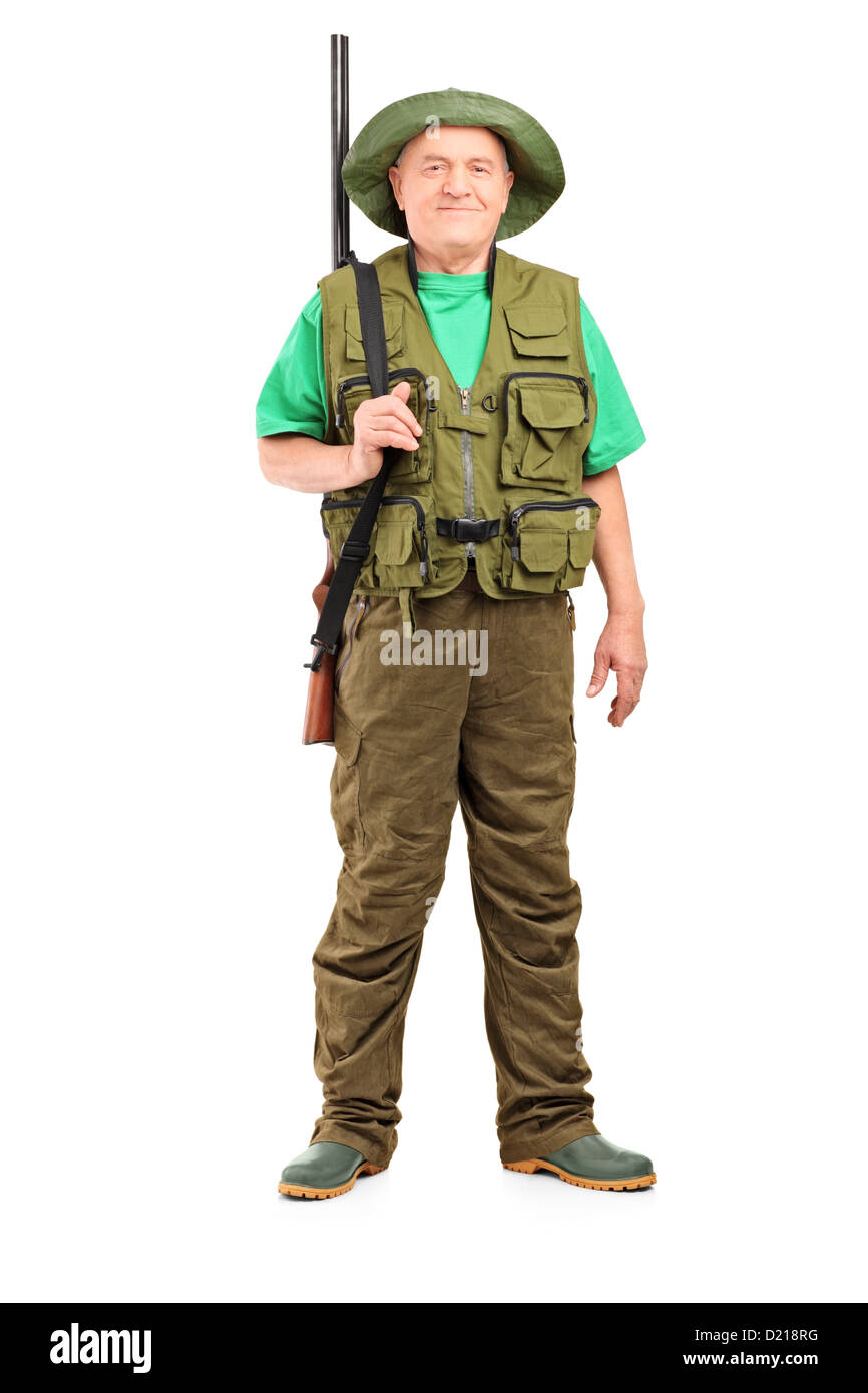 Full length portrait of a male hunter with shotgun posing isolated on ...