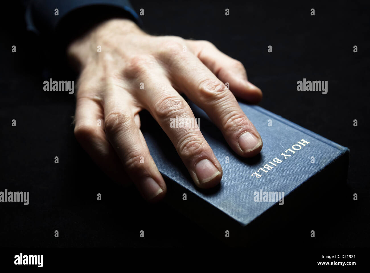 Hand holding bible hi-res stock photography and images - Alamy