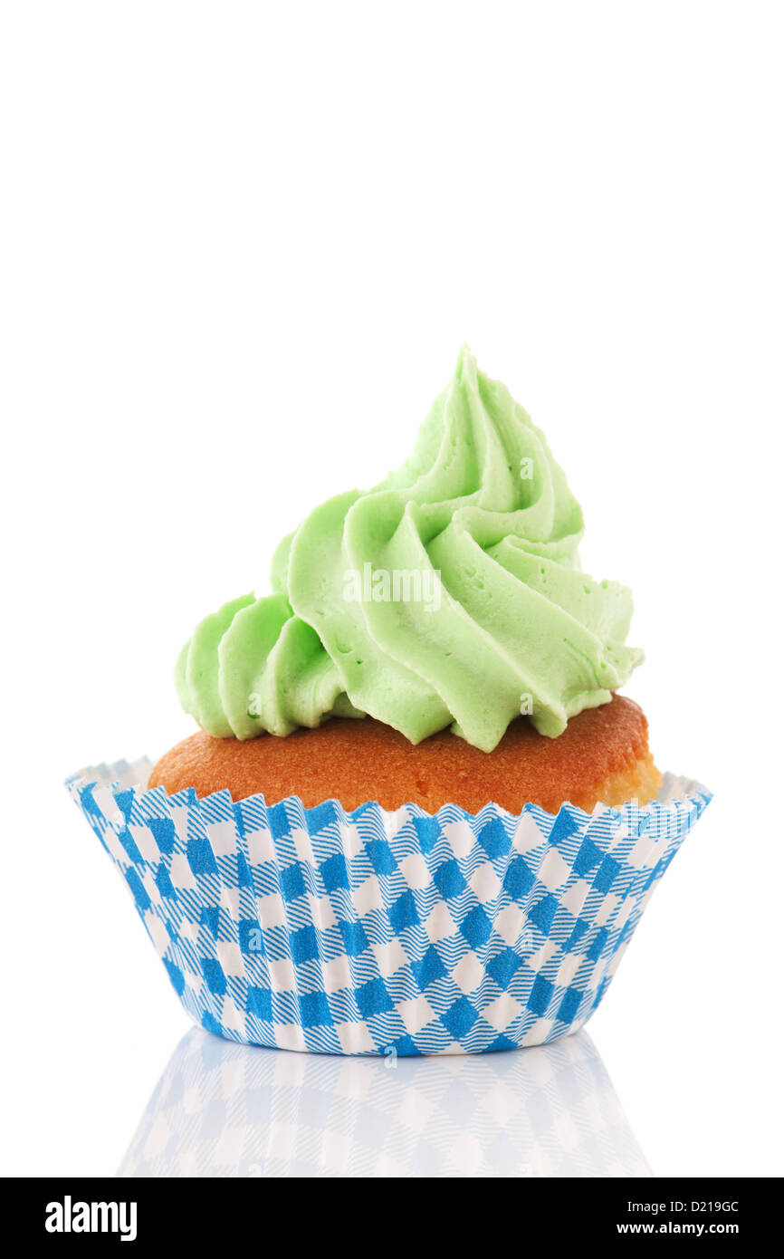 Blue and green cupcake with butter cream isolated over white background ...