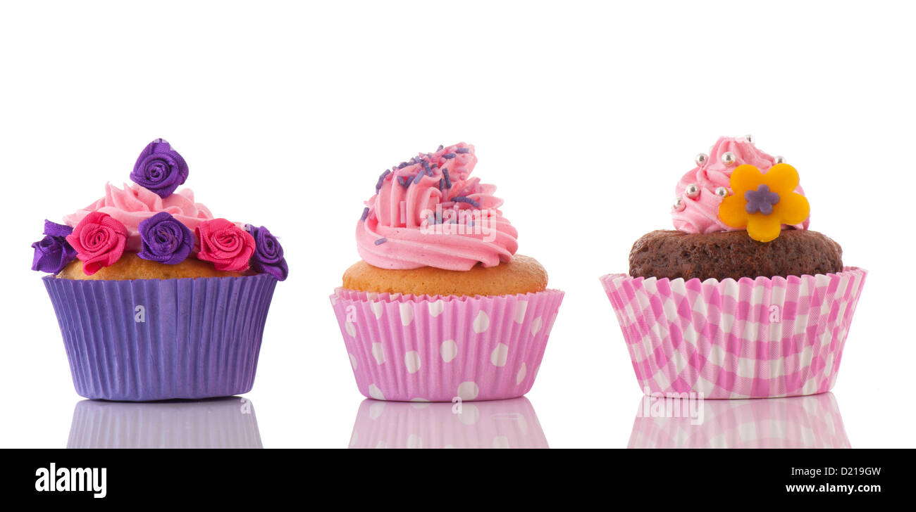 Colorful cupcakes with pink buttercream and flowers Stock Photo - Alamy