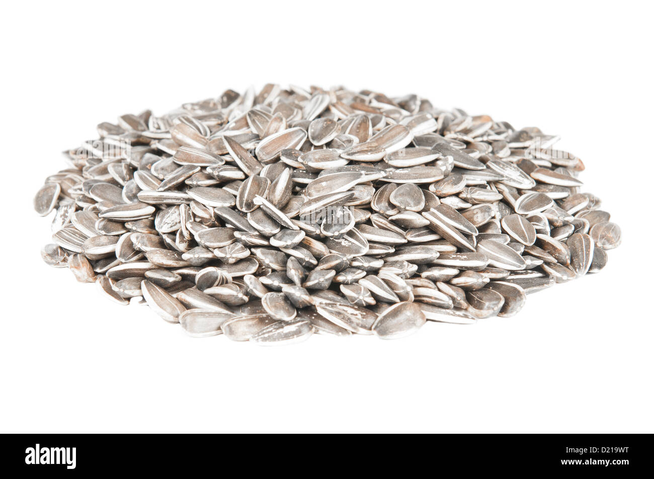 Pile of seeds over a white background Stock Photo - Alamy