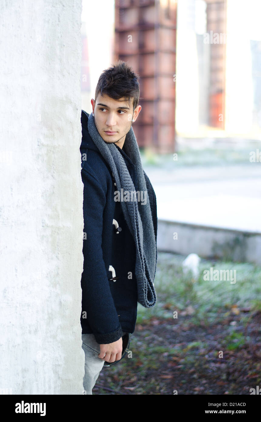 Young man standing behind hi-res stock photography and images - Alamy