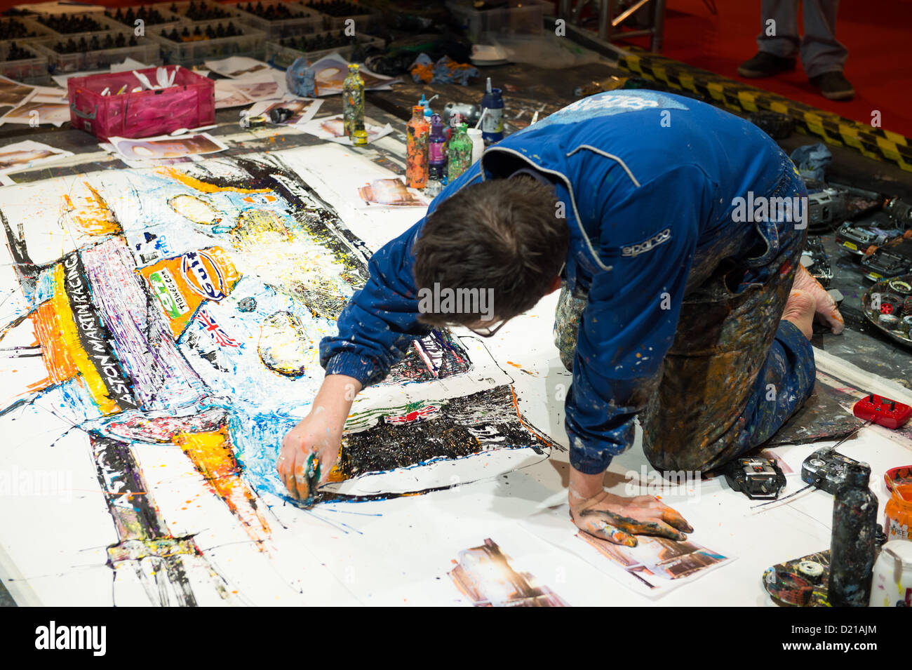 Ian Cook from Popbang Colour paints an image of a sports car on a large ...