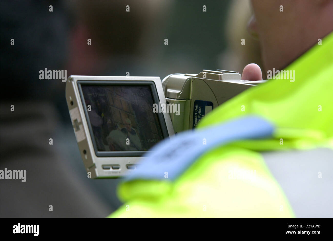 A Policeman with Video Camera Stock Photo - Alamy
