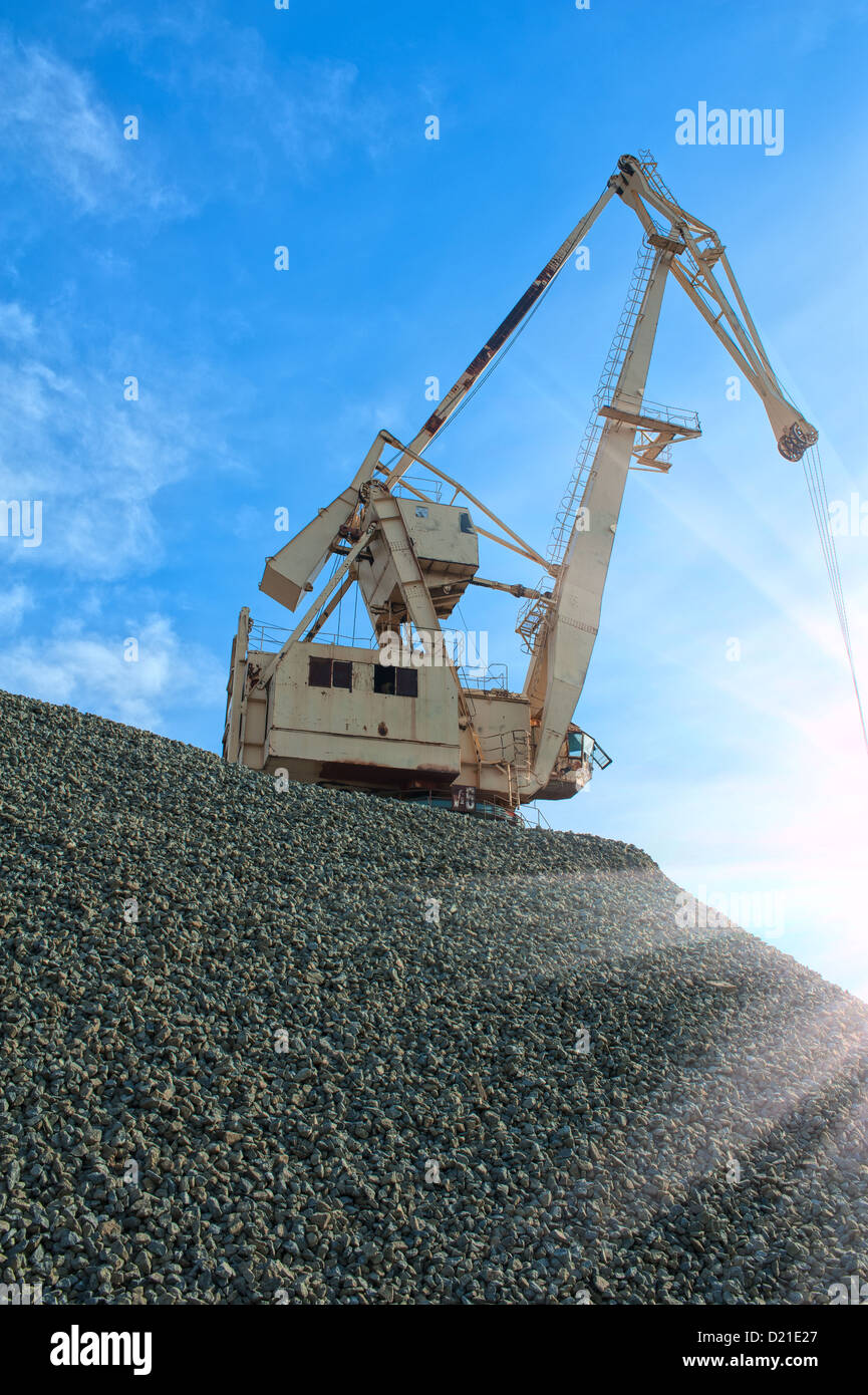 crane at heap of gravel Stock Photo - Alamy