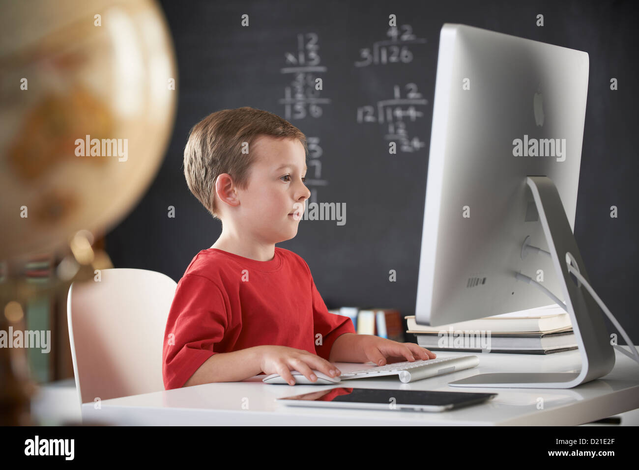 School boy in the classroom with ipad hi-res stock photography and ...