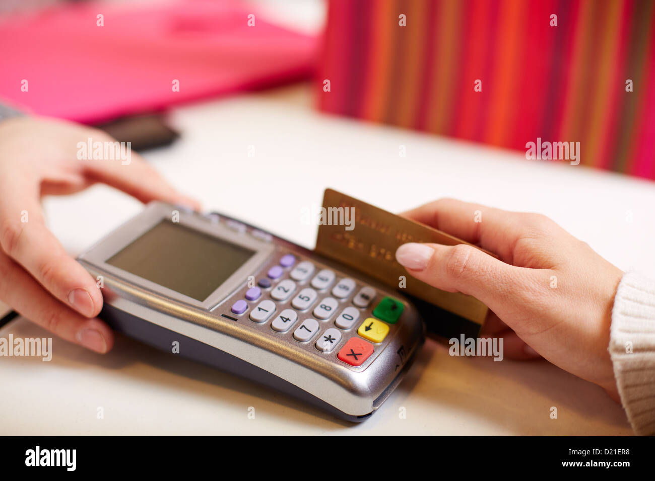 Close-up of payment through machine by plastic card Stock Photo - Alamy