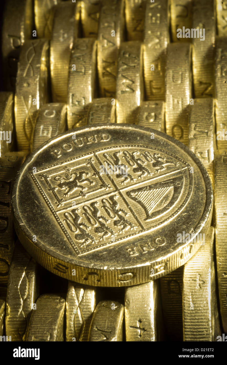A one pound coin on other pound coins Stock Photo - Alamy